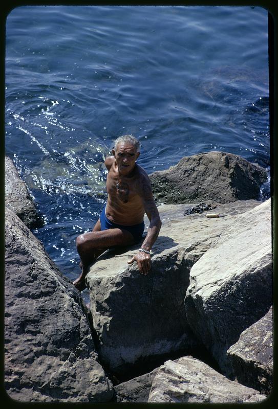 Man swimming from rocks, Naples, Italy - Digital Commonwealth