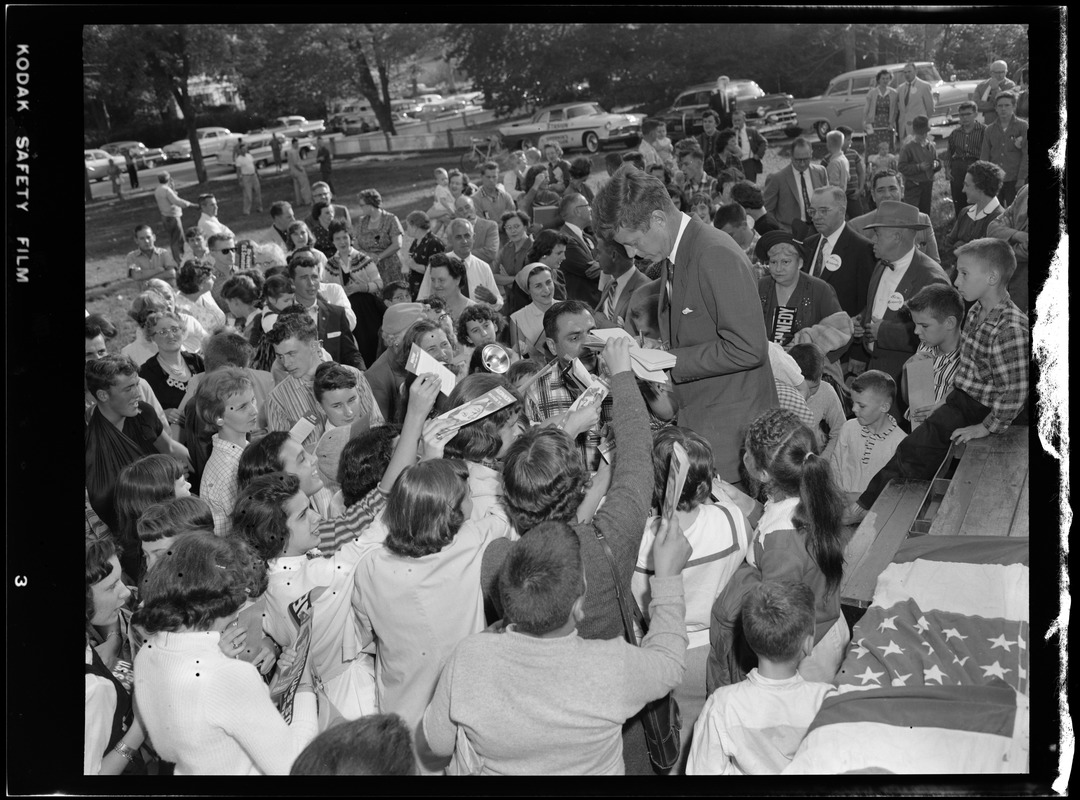 JFK signing autographs during Senate campaign - Digital Commonwealth