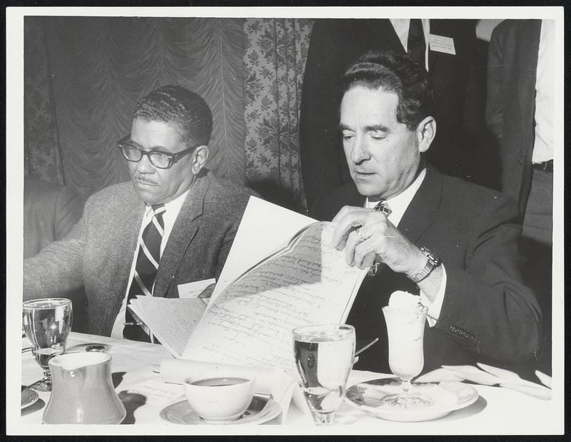Brandeis University President Morris B. Abram, right, studies notes ...
