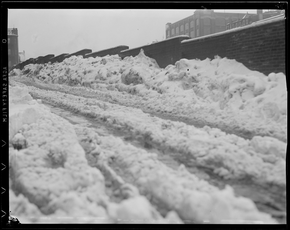 Snow piled high against wall - Digital Commonwealth