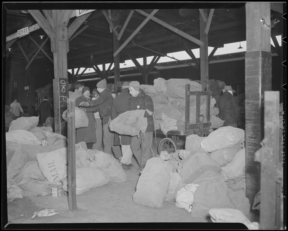 Loading and unloading mail from trains at South Station during ...