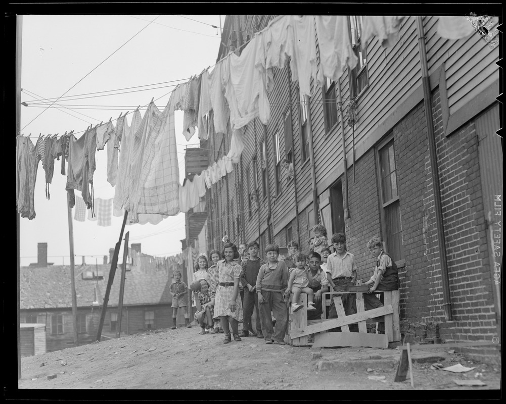 Group of kids in backyard of tenement - Digital Commonwealth