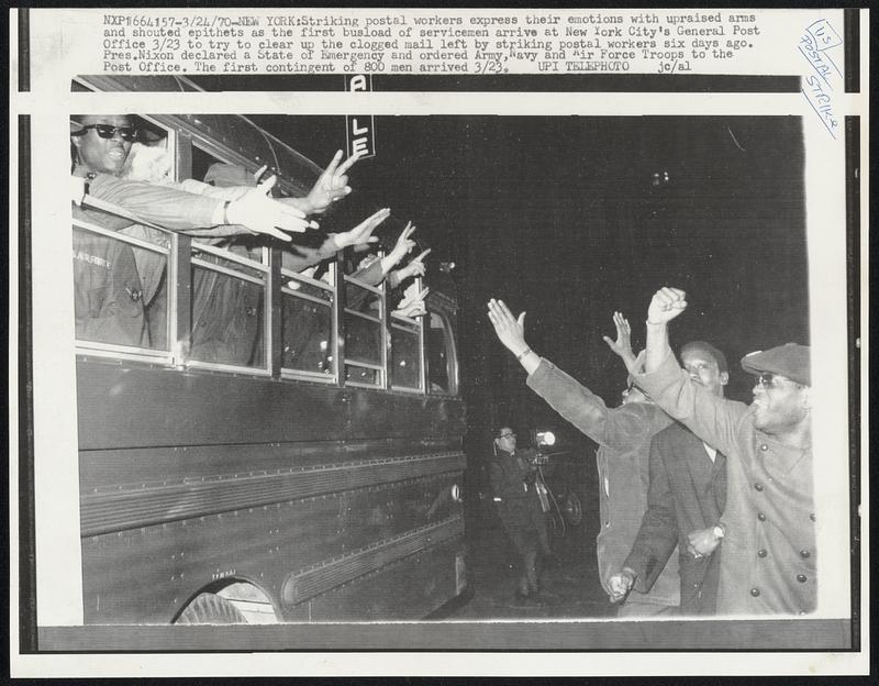 Striking postal workers express their emotions with upraised arms and ...