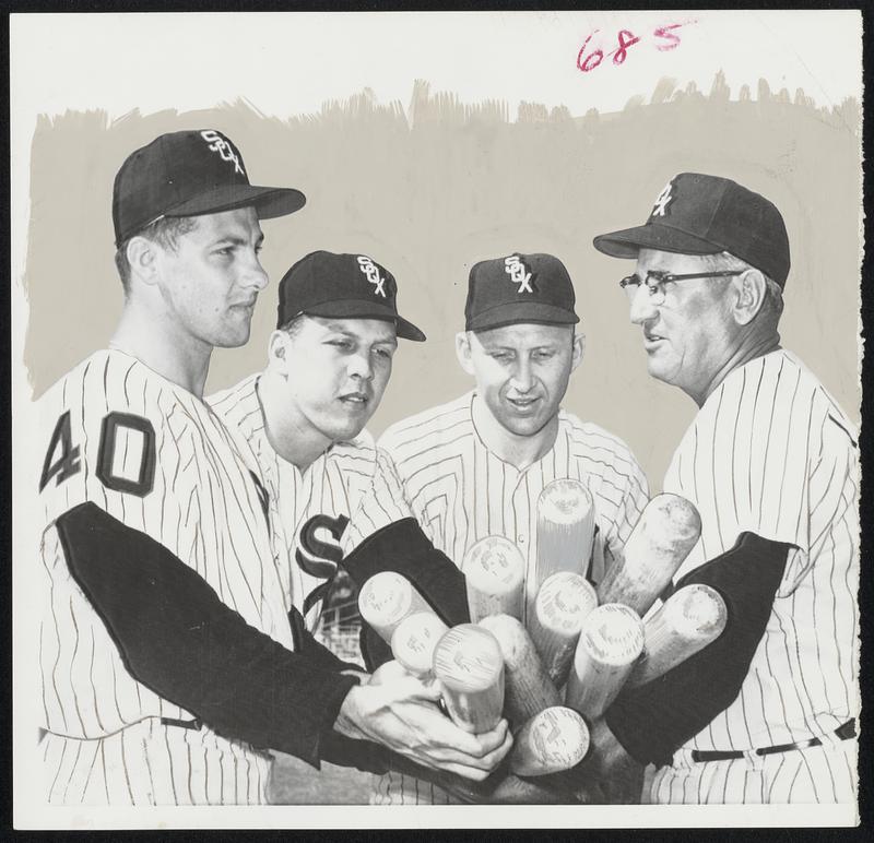 Chicago Manager Al Lopez hands over a load of bats to new players at ...