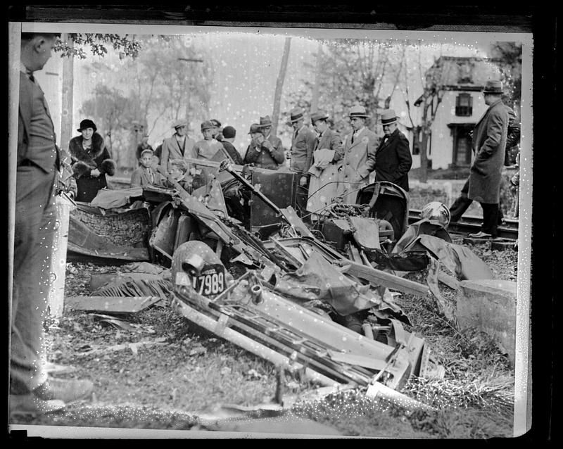 People gathered around a completely wrecked car - Digital Commonwealth