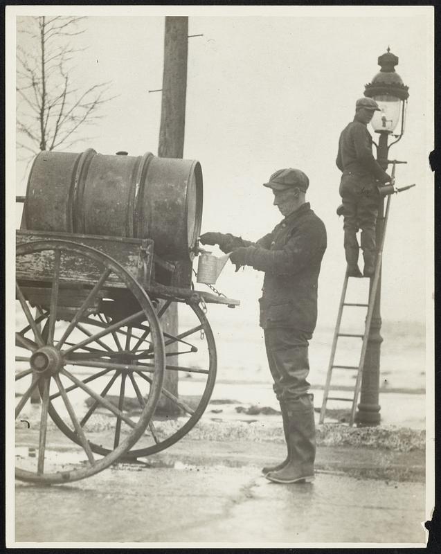 Lamp-lighters The Boston Lamplighter on the job - Digital Commonwealth
