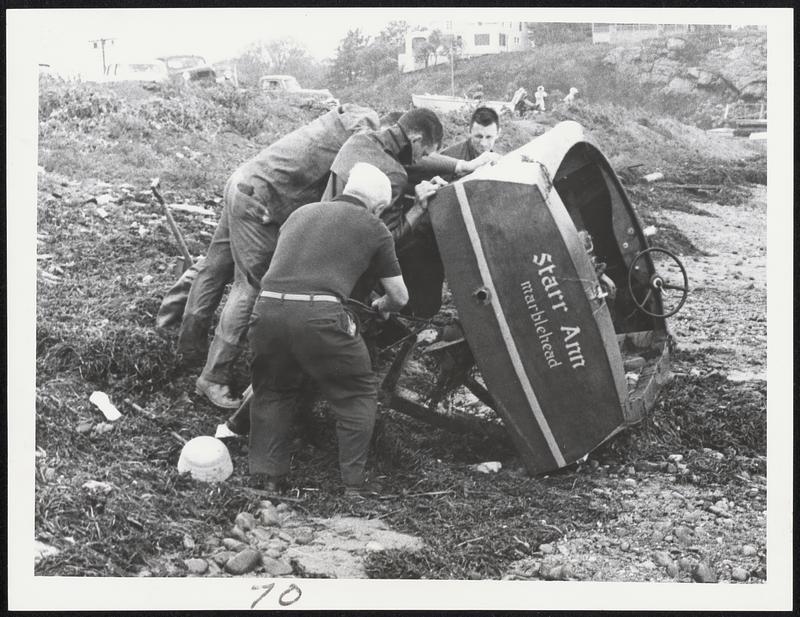 Casualty of Esther--Marbleheaders join in inspecting the bottom of this ...