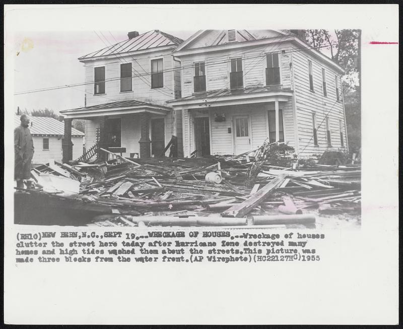 Wreckage of Houses -- Wreckage of houses clutter the street here today ...