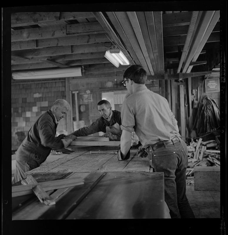 Men working in Pert Lowell's boat shop - Digital Commonwealth