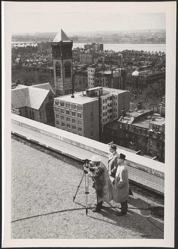 Surveying crew on roof of New England Life Building - Digital Commonwealth