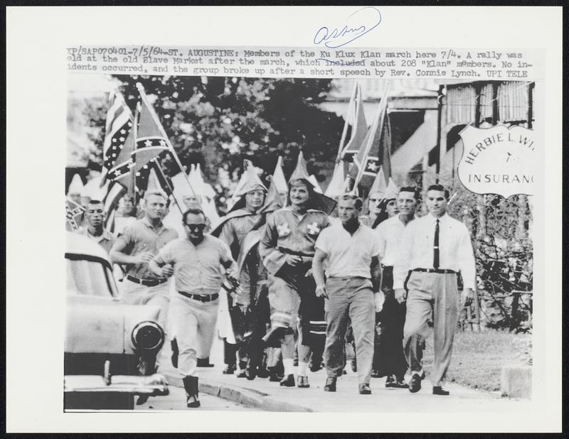 Members of the Ku Klux Clan march here 7/4. A rally was held at the old ...