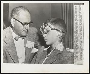 New Lens Demonstrated--Dr. William Feinbloom, assistant professor at ...