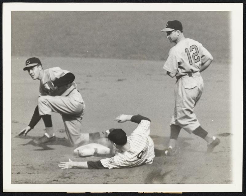 Red Rolfe, Yankees third baseman, is shown being forced out at second ...