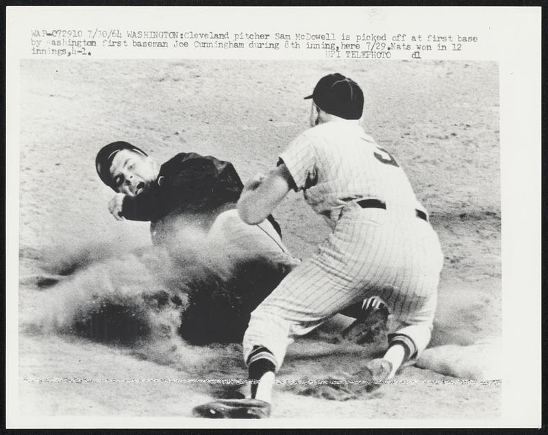 Cleveland pitcher Sam McDowell is picked off at first base by ...