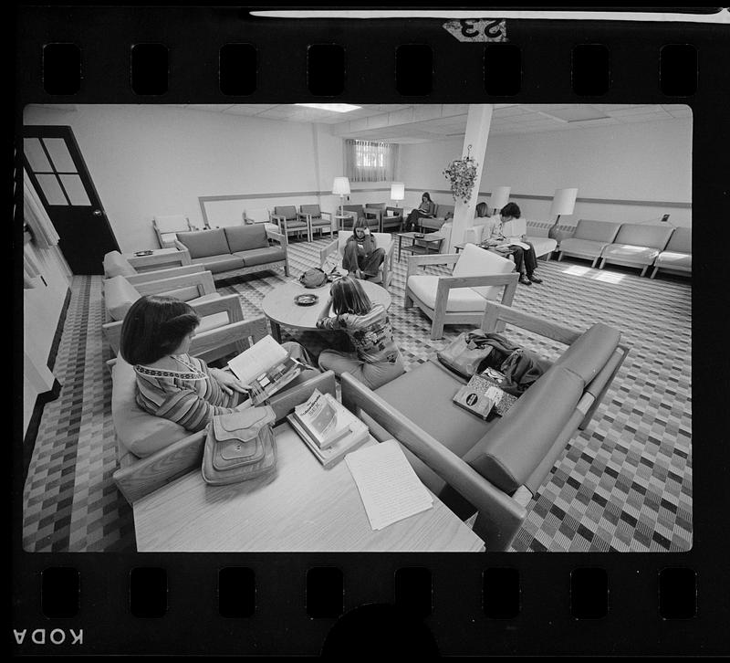 People read in lounge area - Digital Commonwealth
