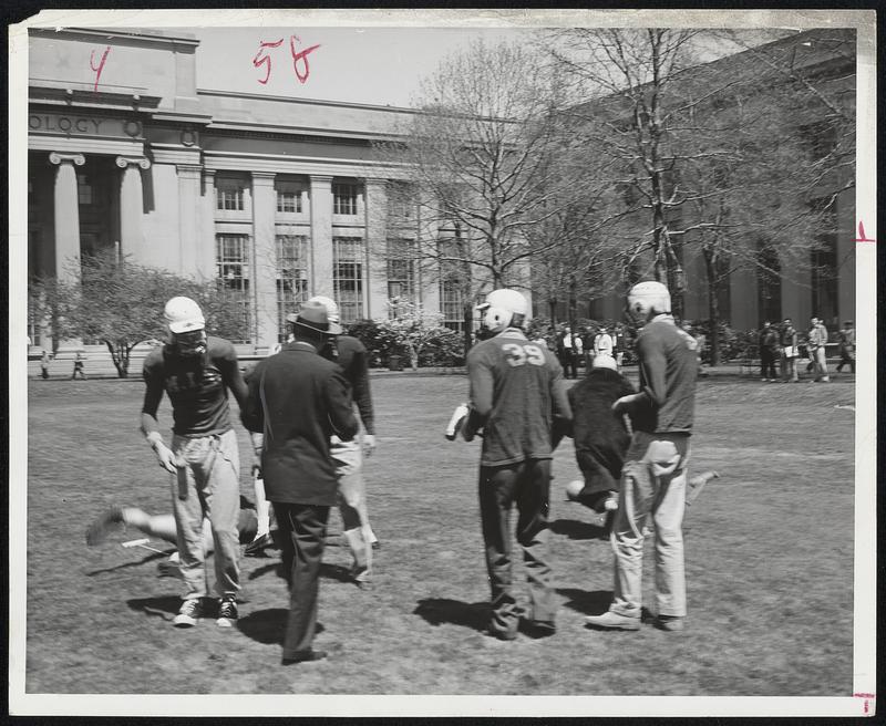 Referee Frederick G. Fassett Jr. (man in the soft hat) attempts to ...
