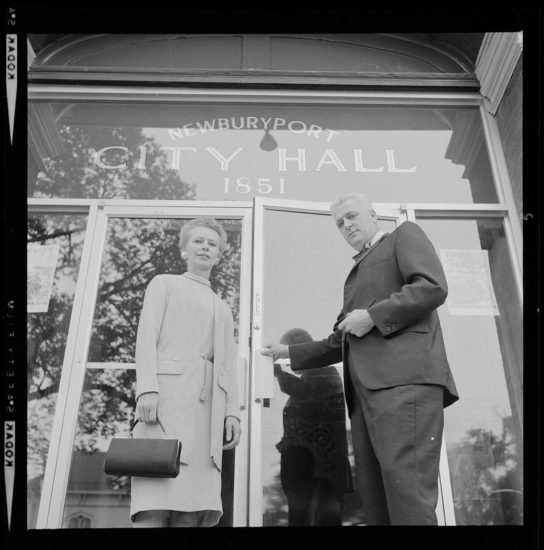 Mr. and Mrs. Norman Doyle on city hall steps - Digital Commonwealth