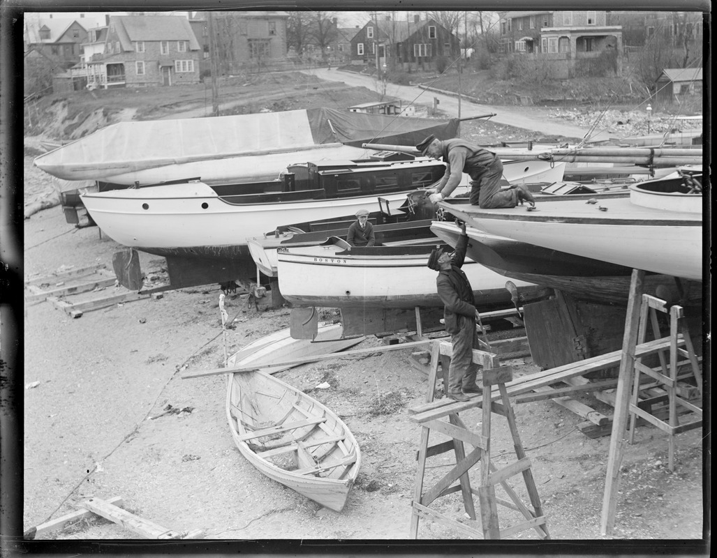 Working on sail boat in boatyard - Digital Commonwealth