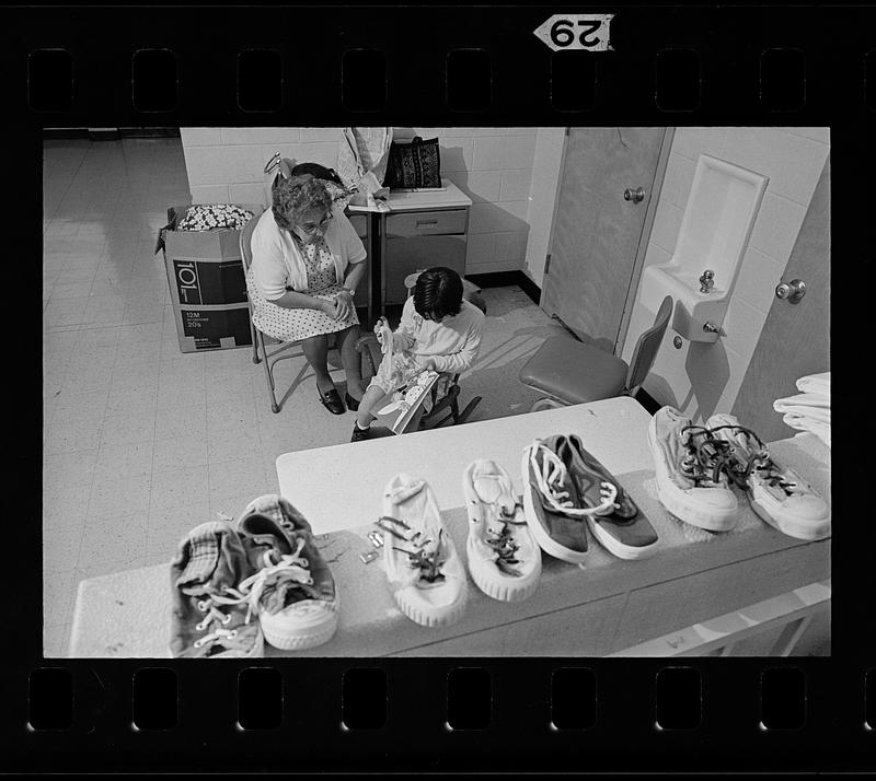 Retired volunteer "foster grandmother" works with retarded child at the ...