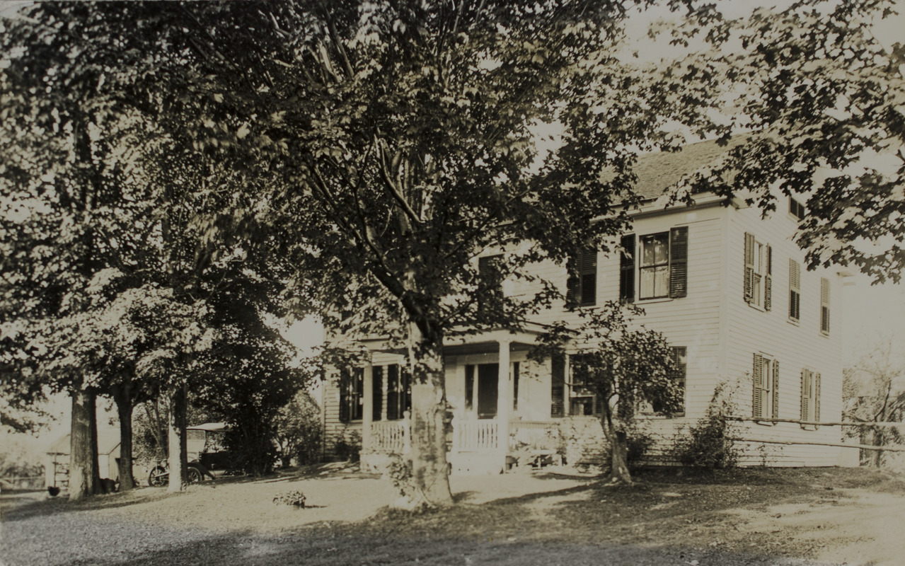 House with model T Ford in driveway - Digital Commonwealth