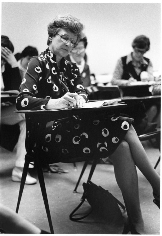 Women at desks in classroom - Digital Commonwealth