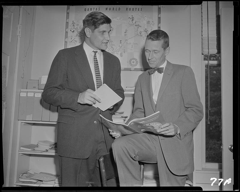 Two men looking at magazine - Digital Commonwealth