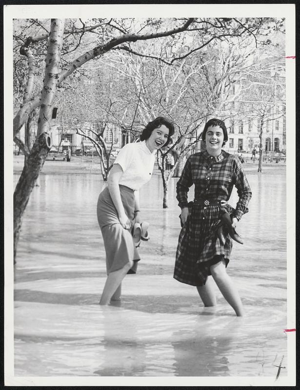 Two Girls go wading on their way to Katharine Gibbs school as water ...