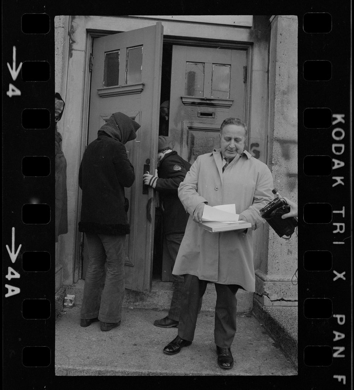 Cambridge health inspector and constable, Joseph DeLeo, holding an ...