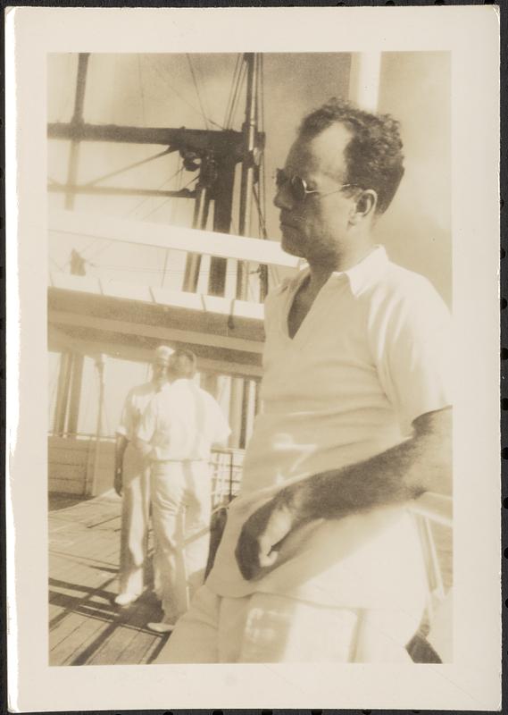 Men standing on a ship deck - Digital Commonwealth