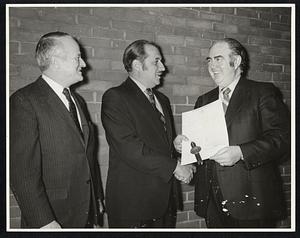 Gregory H. Adamian, center, president of Bentley College in Waltham ...