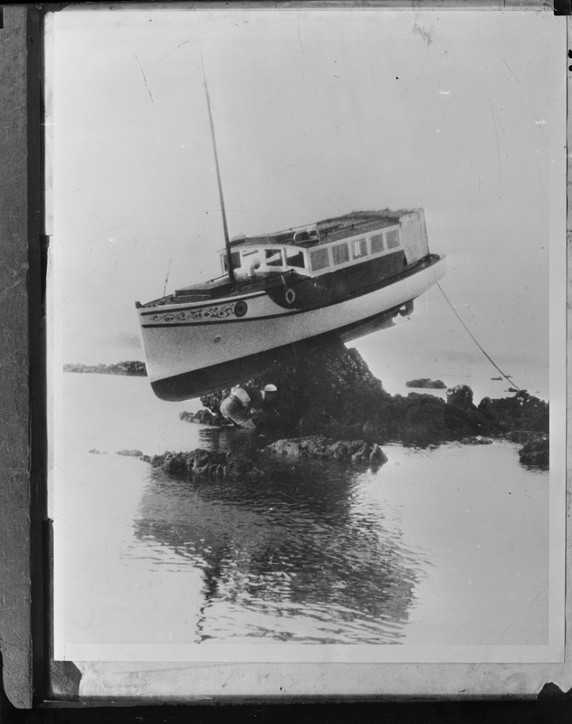 Boat stranded and left high and dry on rock - Digital Commonwealth