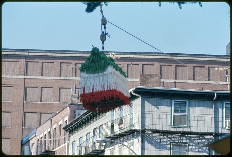 Piñata-like object hanging from pulley - Digital Commonwealth