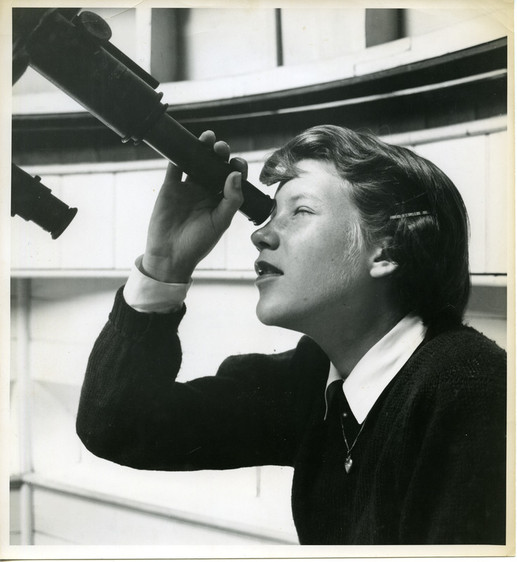 Student using telescope - Digital Commonwealth