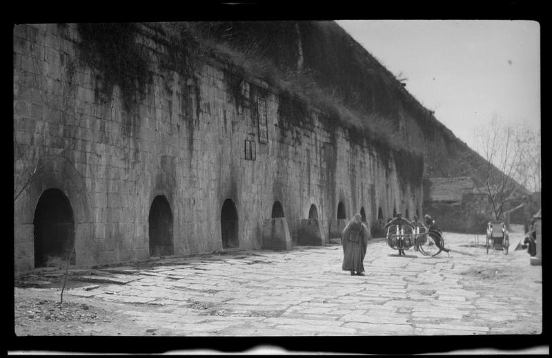 Beggars' caves, with Nanking city wall in background - Digital Commonwealth