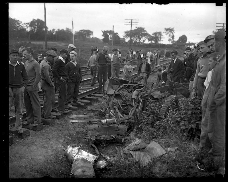 People gathered around a completely wrecked car - Digital Commonwealth