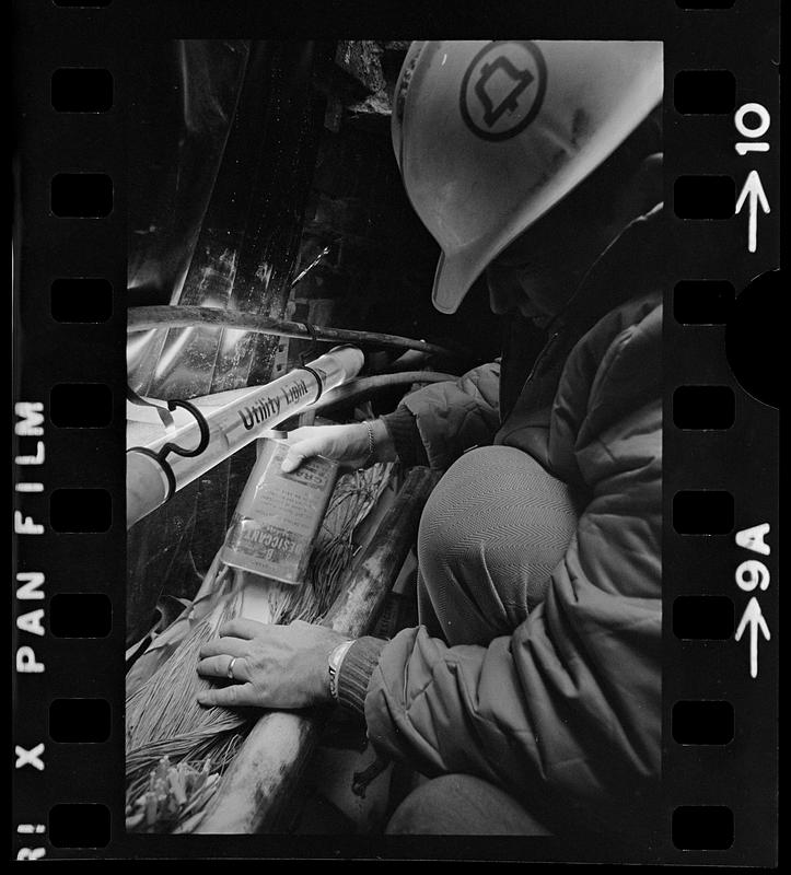 New England Bell technician works at underground cables, Boston ...