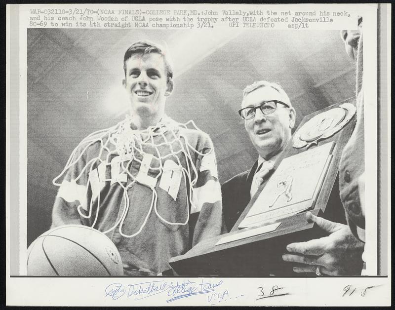 John Vallely, with the net around his neck and his coach John Wooden of ...