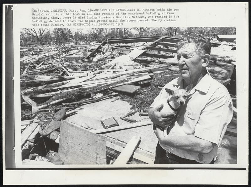 He Left and Lived--Earl B. Mathews holds his pup Gabrial amid the ...