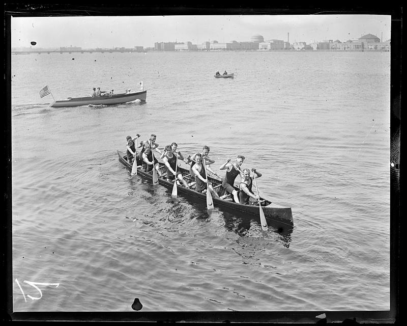 9 people in a canoe, rowing - Digital Commonwealth