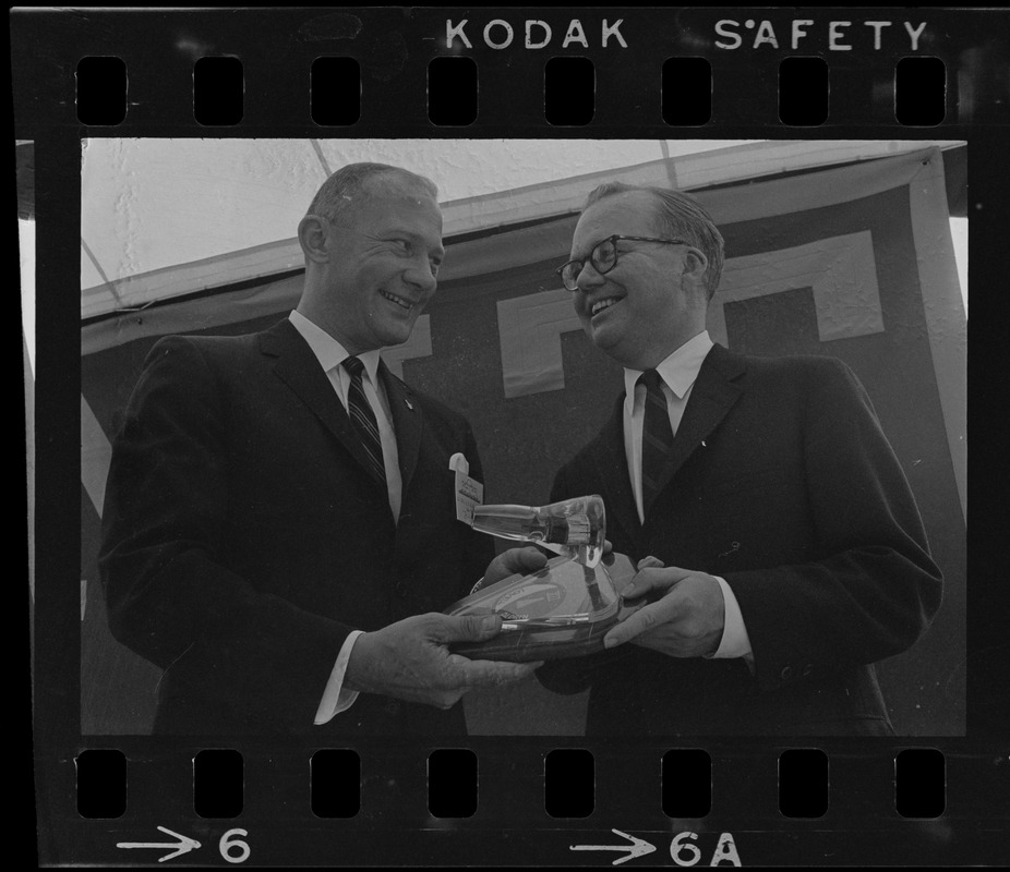 Astronaut Buzz Aldrin, left, presents MIT President Howard Johnson with ...