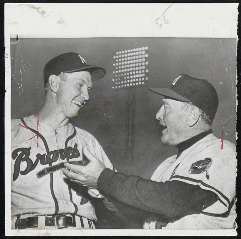 Manager Fred Haney, right, of the pennant-bound Braves holds powwow ...