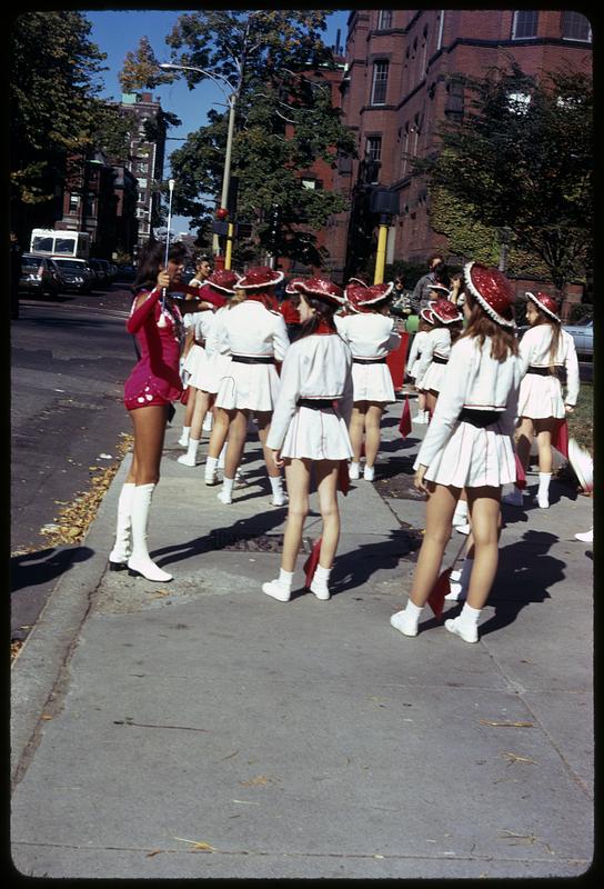Girl with baton talking to girls wearing pink cowboy hats, Boston Columbus Day Parade 1973 ...