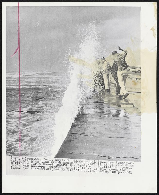 Seawall Splash--Some teenagers watch the high tide crash against the ...