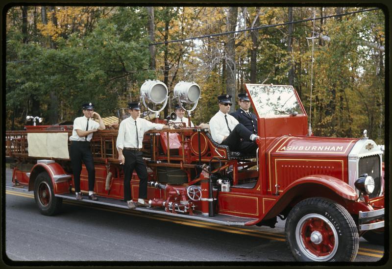 Firemen riding in the Ashburnham antique fire truck in the bicentennial ...