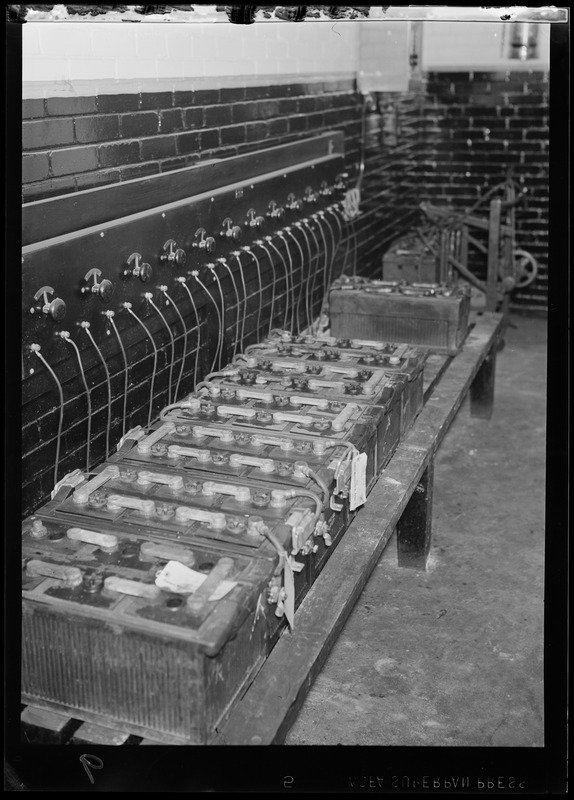 Row of batteries on a shelf - Digital Commonwealth