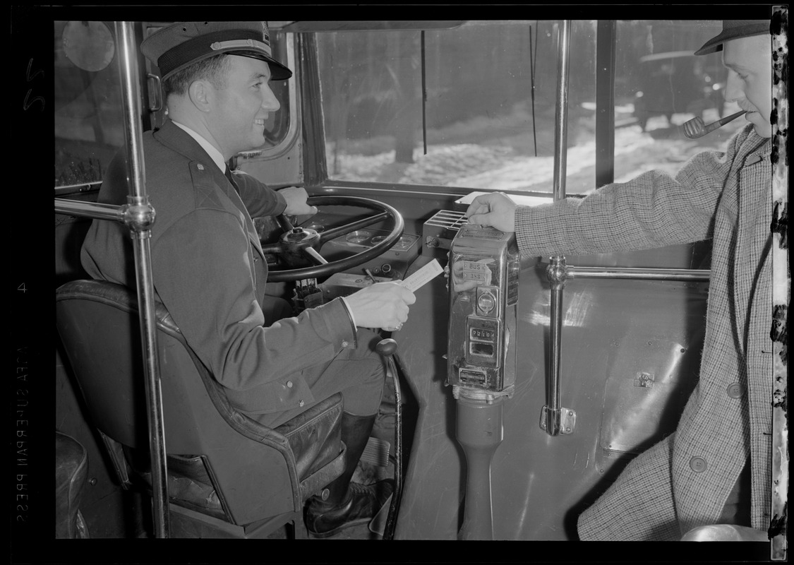 Man paying bus fare next to bus driver - Digital Commonwealth