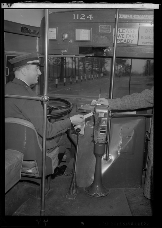 Man paying bus fare next to bus driver - Digital Commonwealth