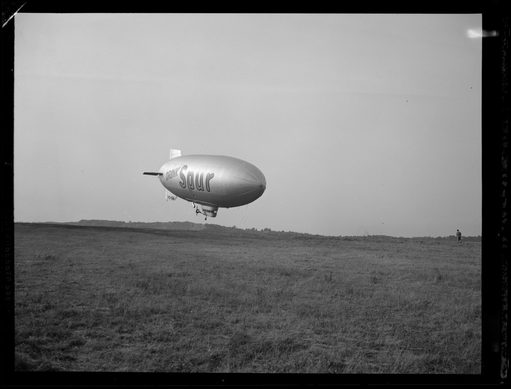 Blimp branded "Drink Spur" hovers low to ground - Digital Commonwealth