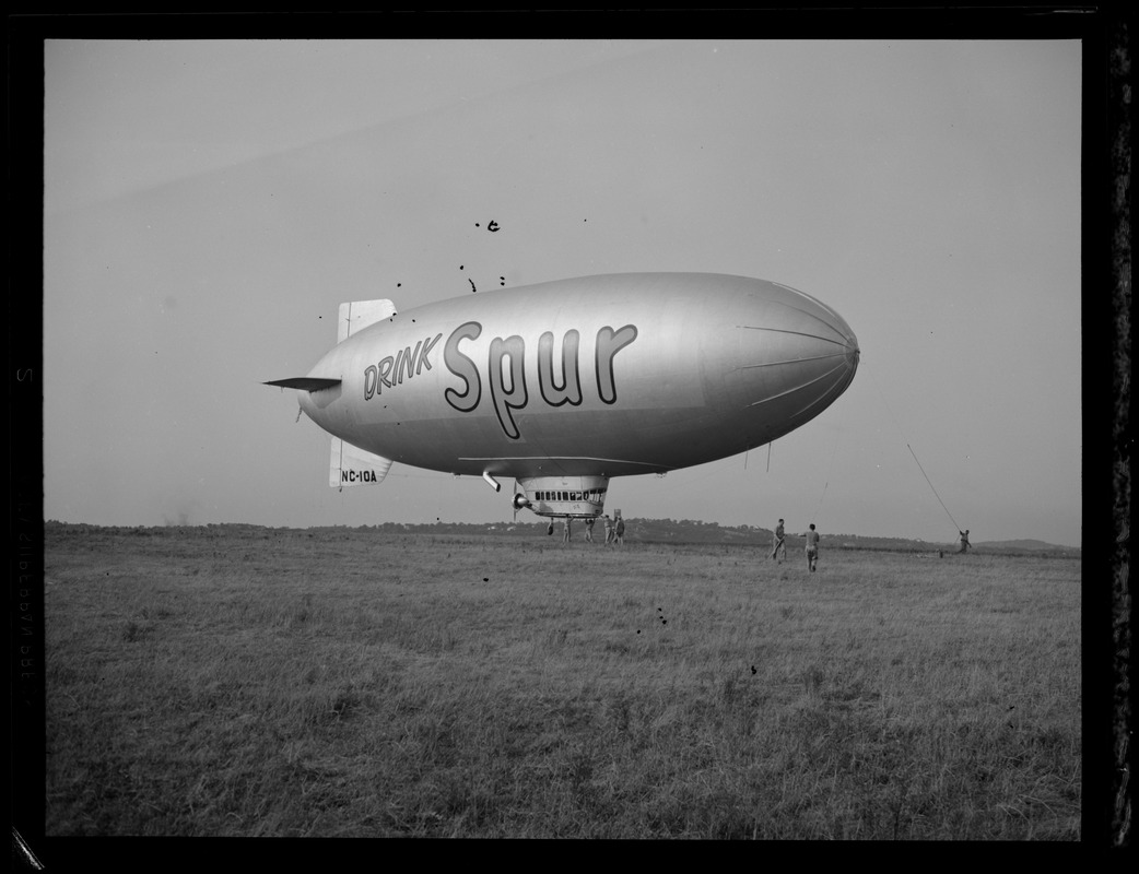Blimp branded "Drink Spur" on ground - Digital Commonwealth