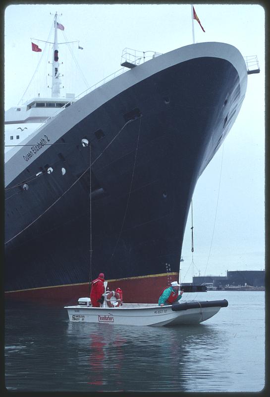 Clean Harbors boat next to liner Queen Elizabeth II, Boston Harbor ...
